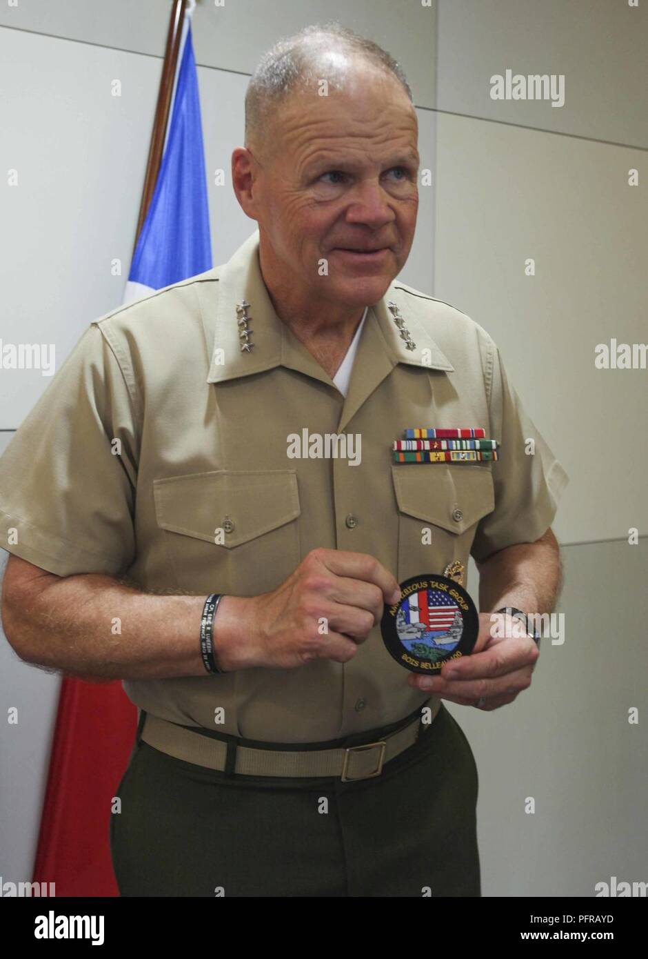 Commandant of the Marine Corps Gen. Robert B. Neller receives a gift ...
