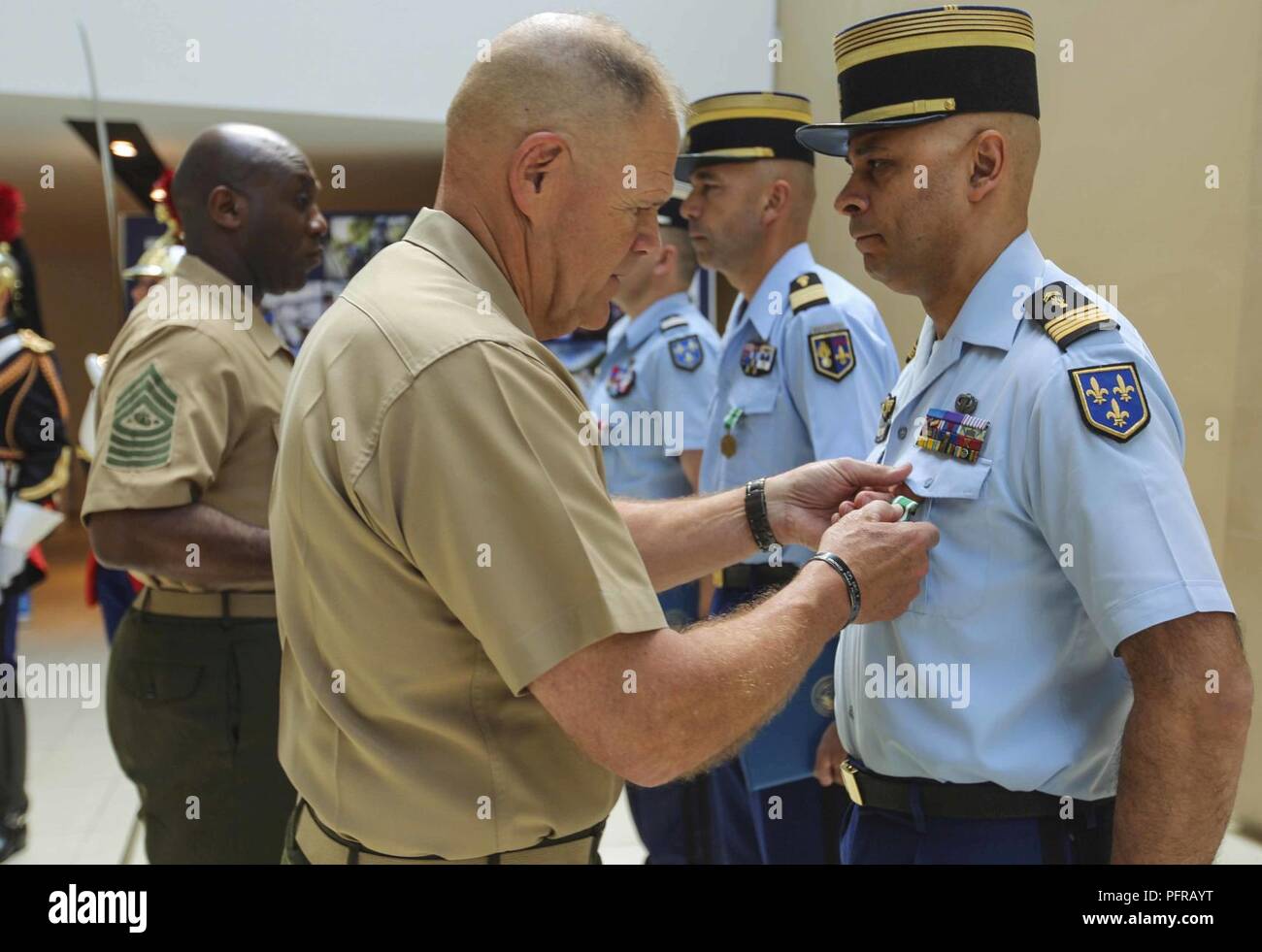 Commandant of the Marine Corps Gen. Robert B. Neller awards the Navy ...