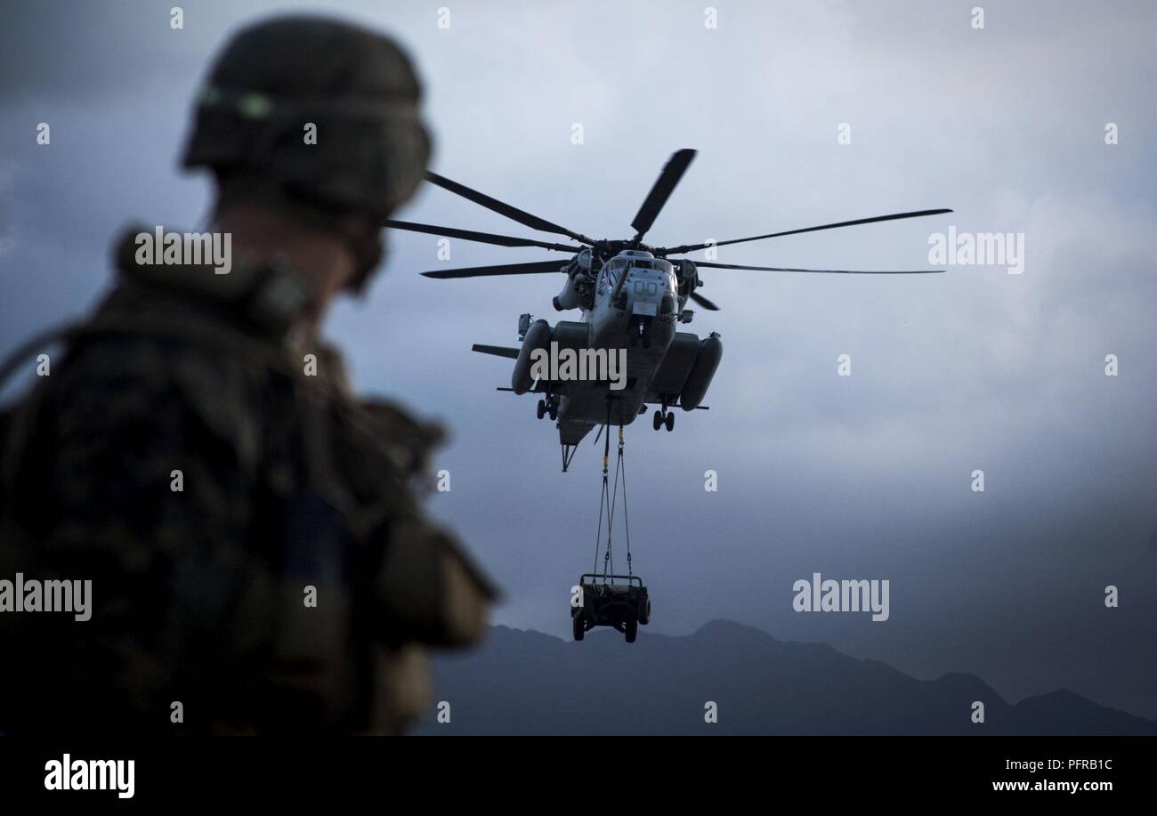 A U.S. Marine with Combat Logistics Battalion 3 (CLB-3) watches a CH ...