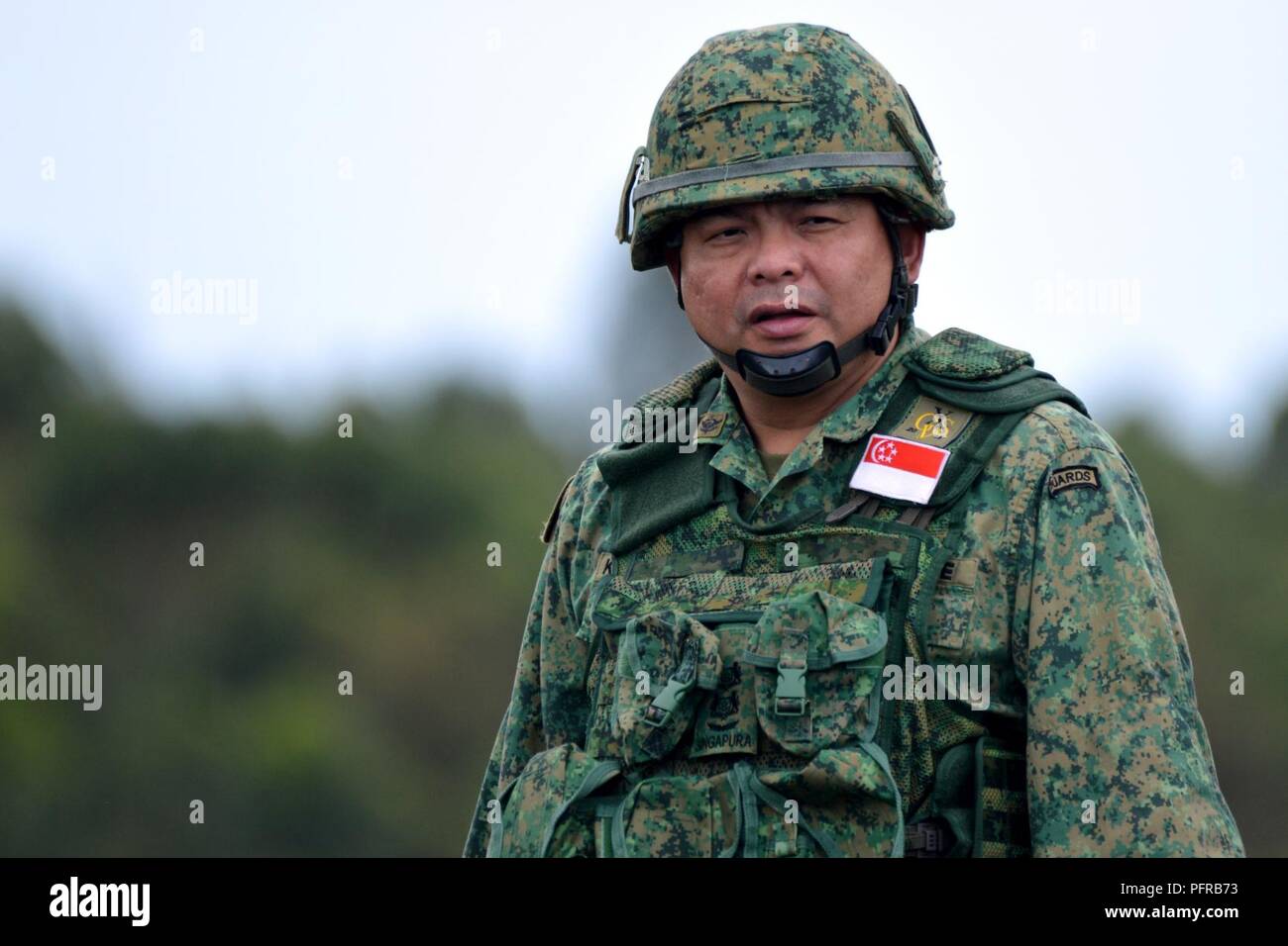 Senior Lt. Col. Jason Kway, 6th Division, Singapore Army, observes a ...