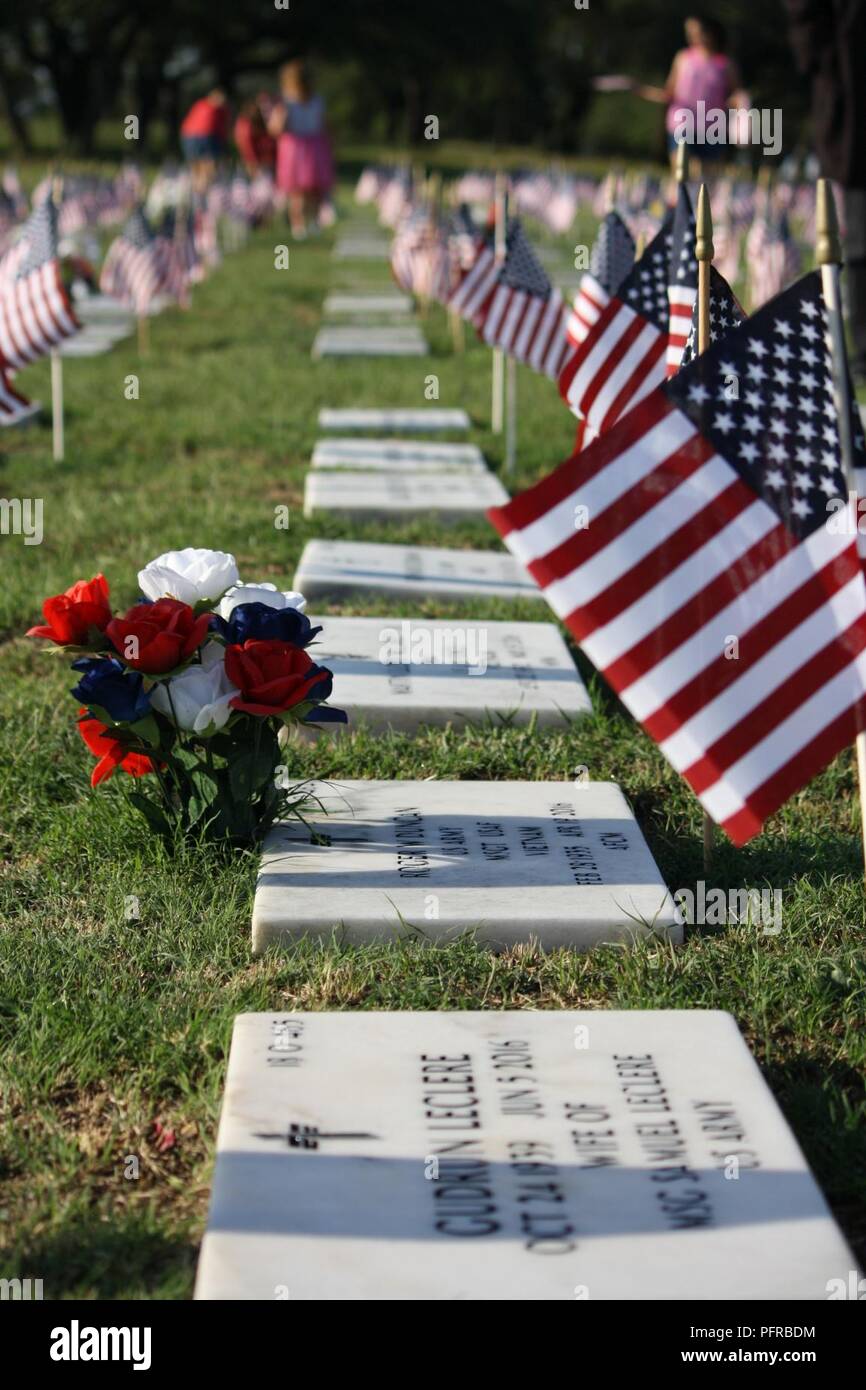Community members participate in flag laying at the Central Texas State ...