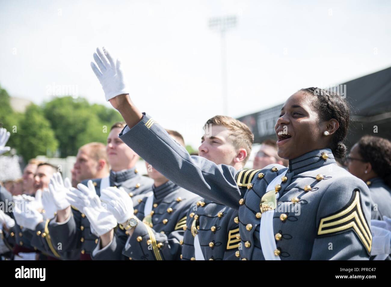 U.S. Military Academy cadets wave to their families during their ...