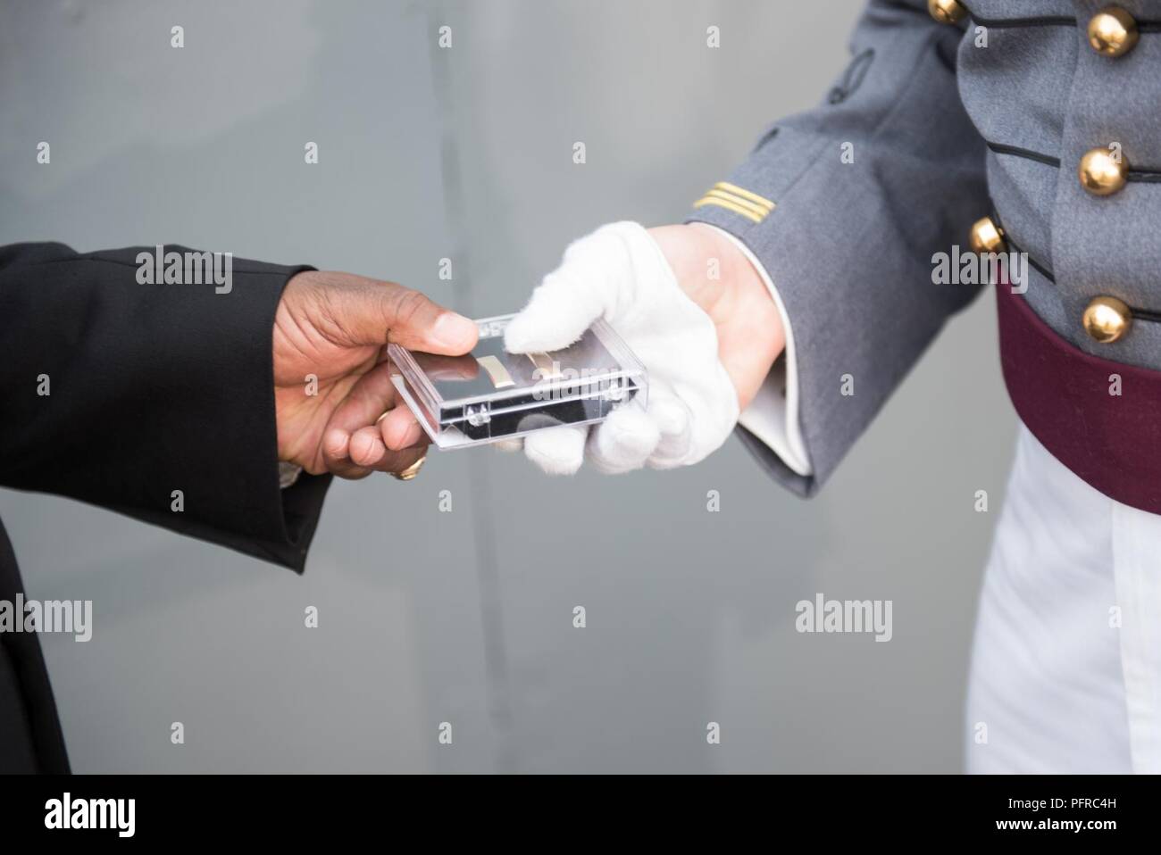 A Class of 1968 graduate presents Lieutenant bars to a U.S. Military ...