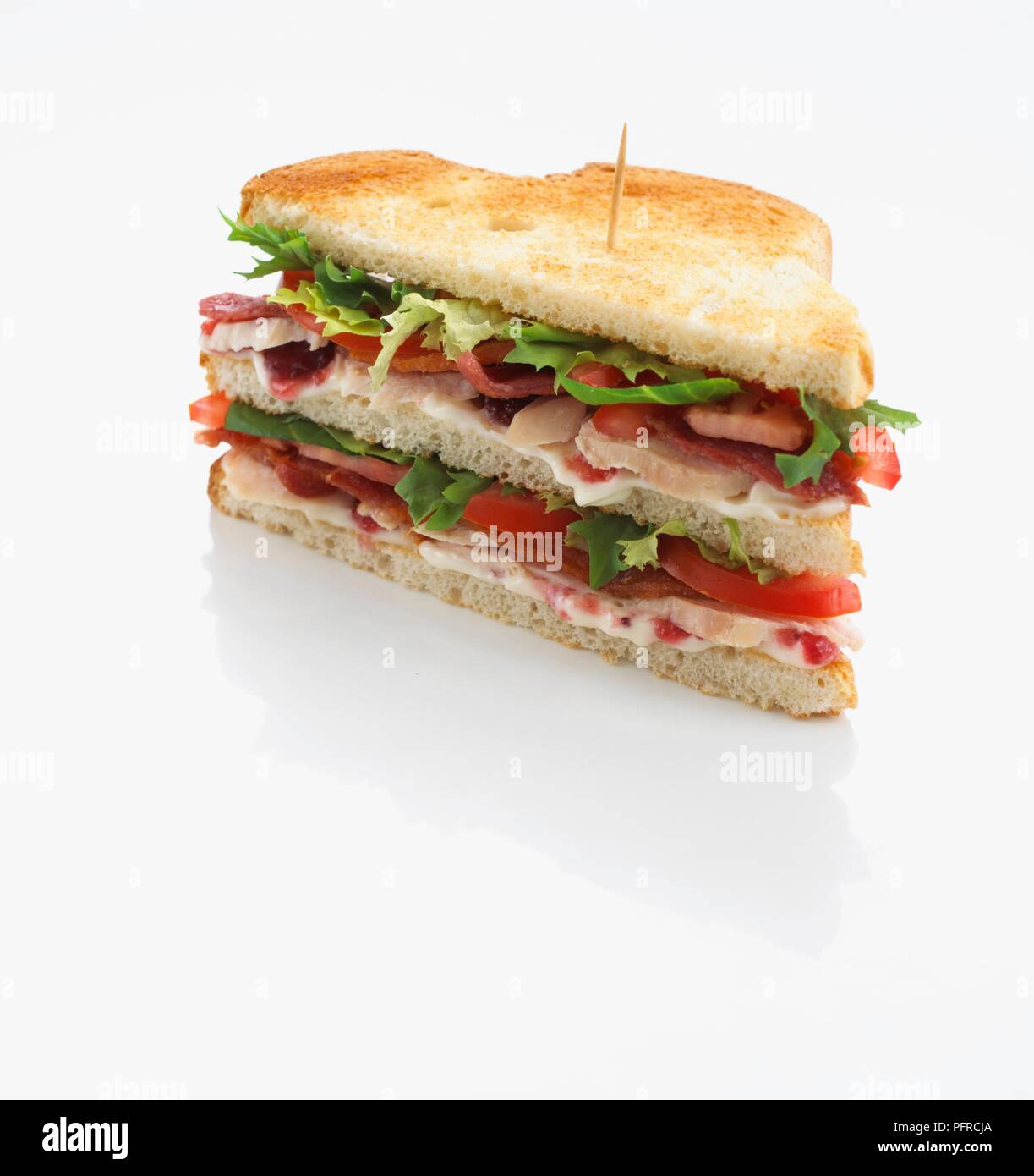 Toasted club sandwich held together with wooden skewer Stock Photo - Alamy
