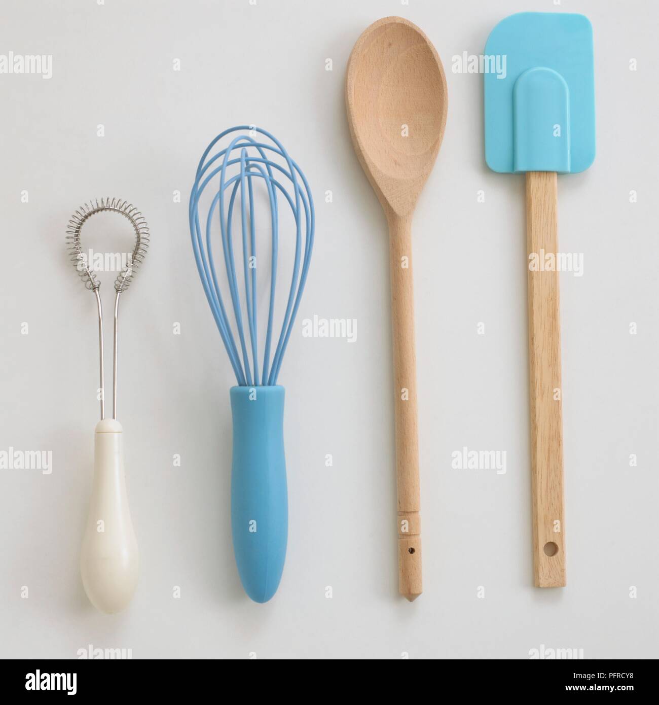 Whisks, wooden spoon and a spatula Stock Photo - Alamy