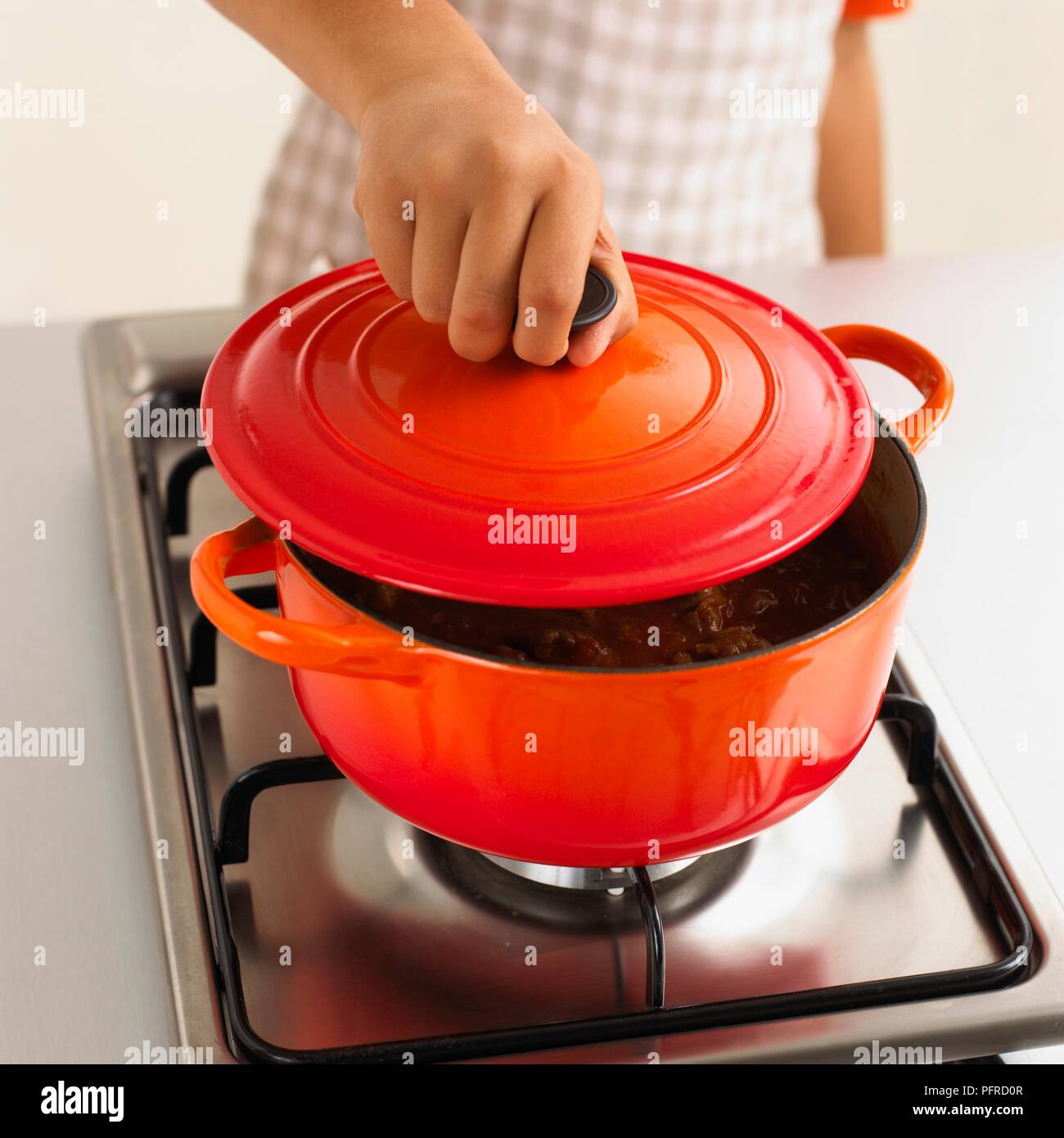 Placing lid hi-res stock photography and images - Alamy