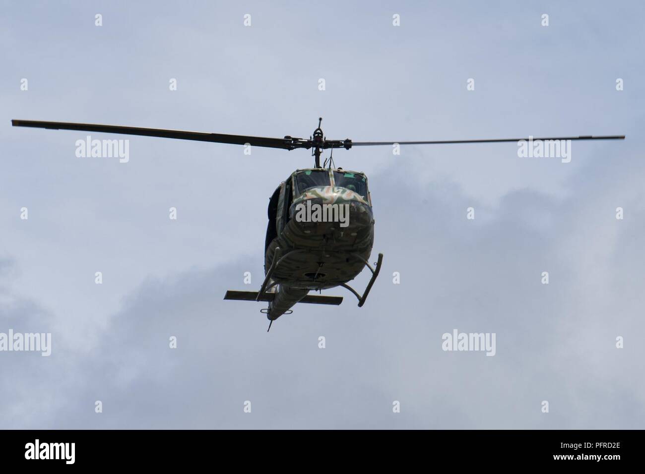 A UH-1 "Huey" helicopter, flies over a Memorial Day ceremony, May 28 ...