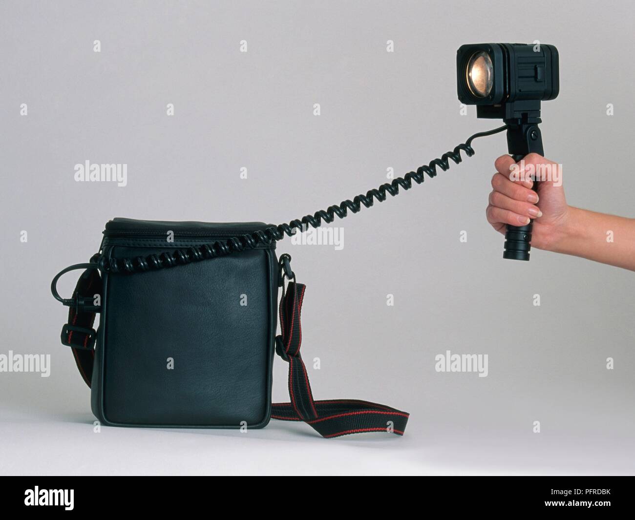 Hand held light and power pack Stock Photo - Alamy