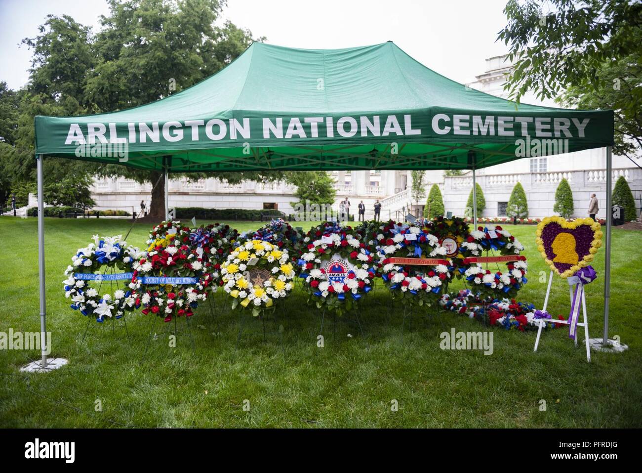 Wreaths sit under an awning in preparation for Memorial Day at ...