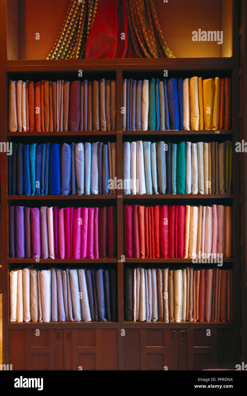 Selection of swatches of colourful Thai silk on shelves Stock Photo - Alamy