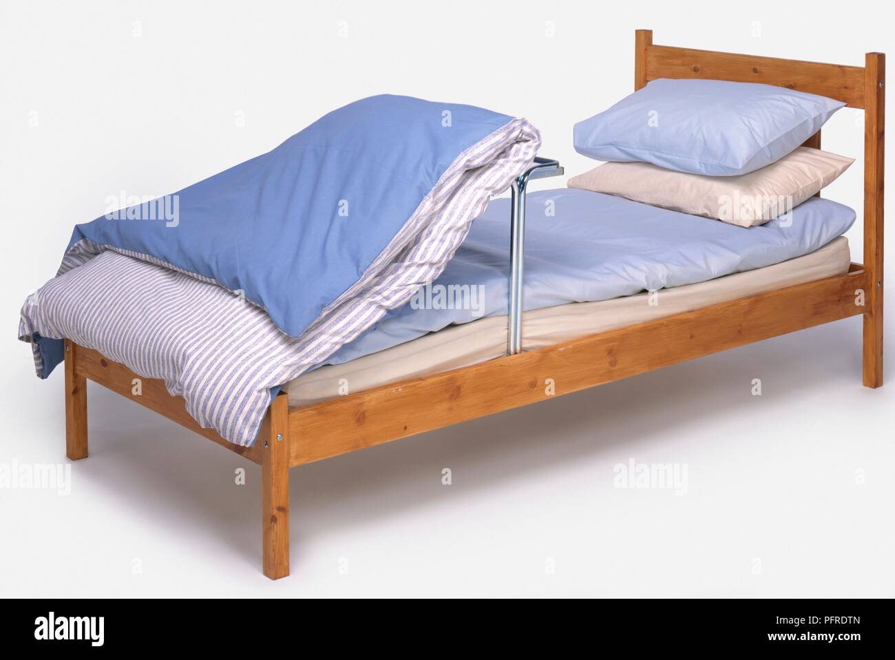 Bed blanket raiser and bed Stock Photo - Alamy
