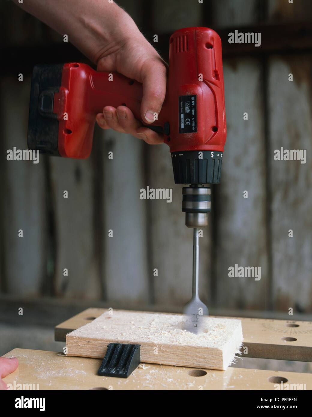 Drilling a hole through front piece of nesting box, close-up Stock ...