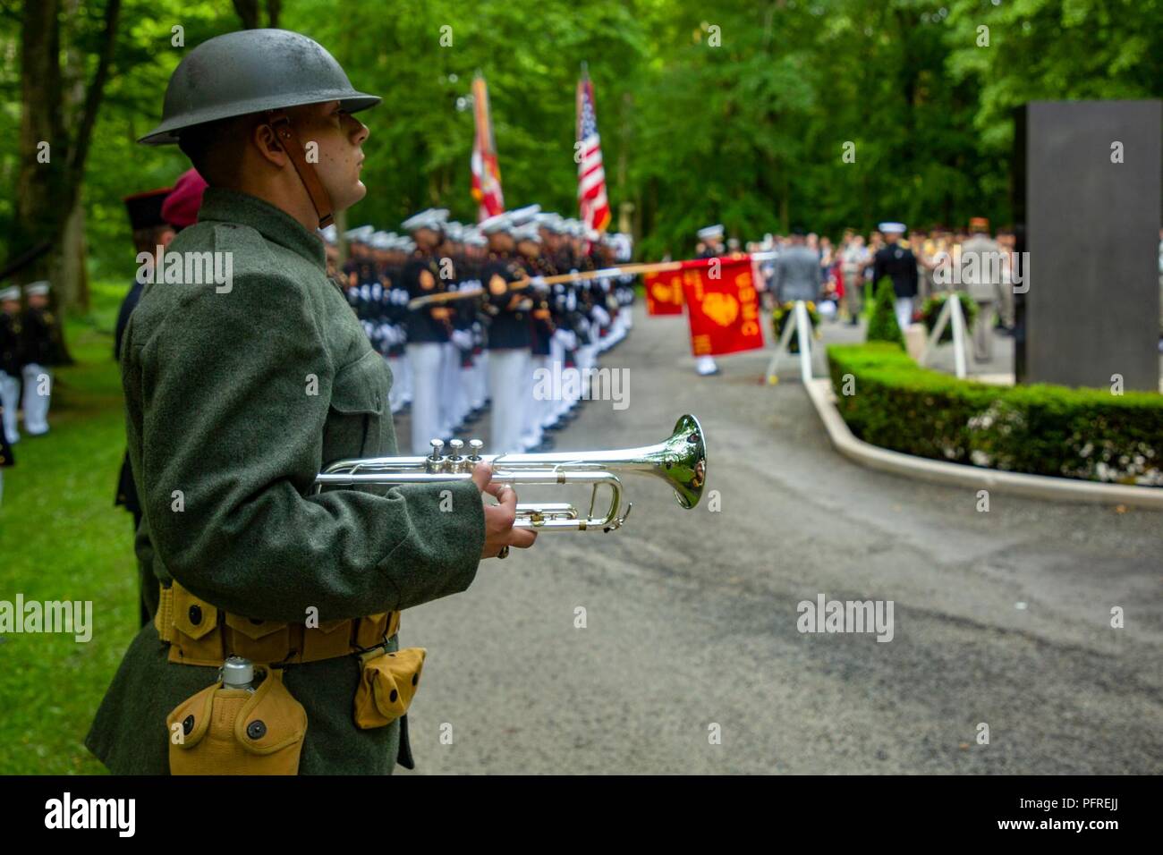 A U.S. Marine Corps bugler, dressed in a World War I period uniform ...