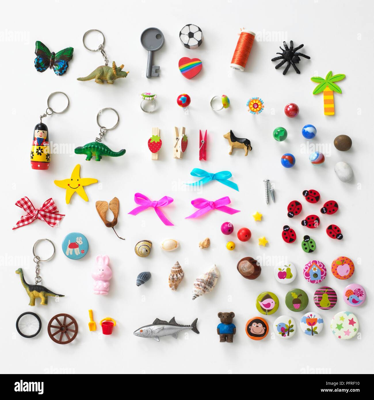 Abundance of small toys, badges, keyrings, shells and conkers Stock ...
