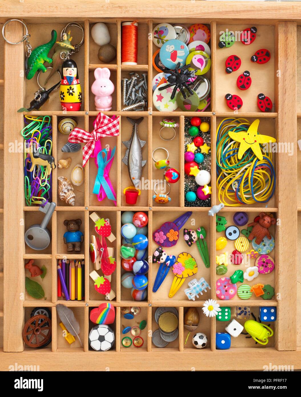 Abundance of small toys, and badges, buttons, shells, paperclips ...