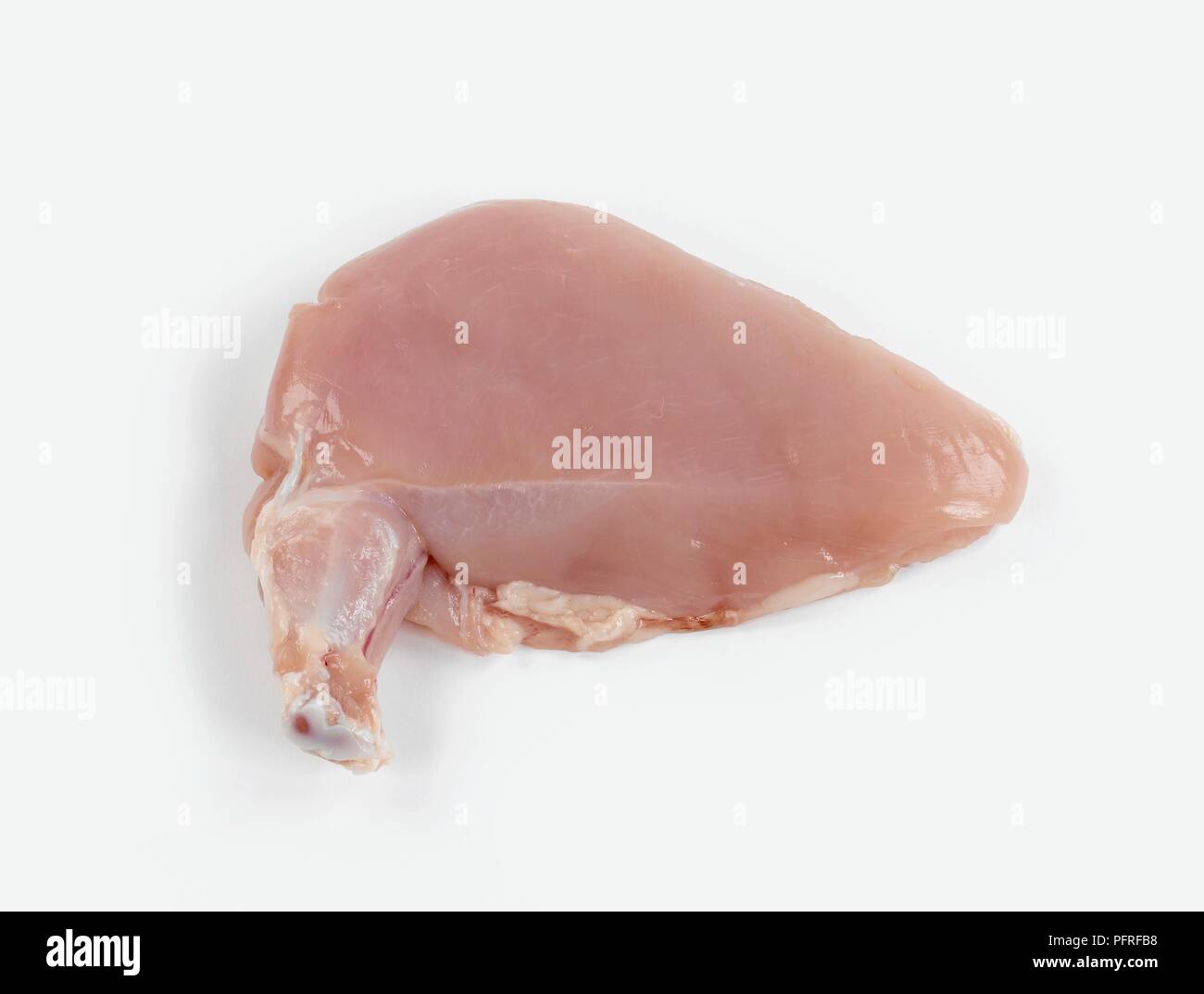 Raw skinned chicken supreme Stock Photo - Alamy