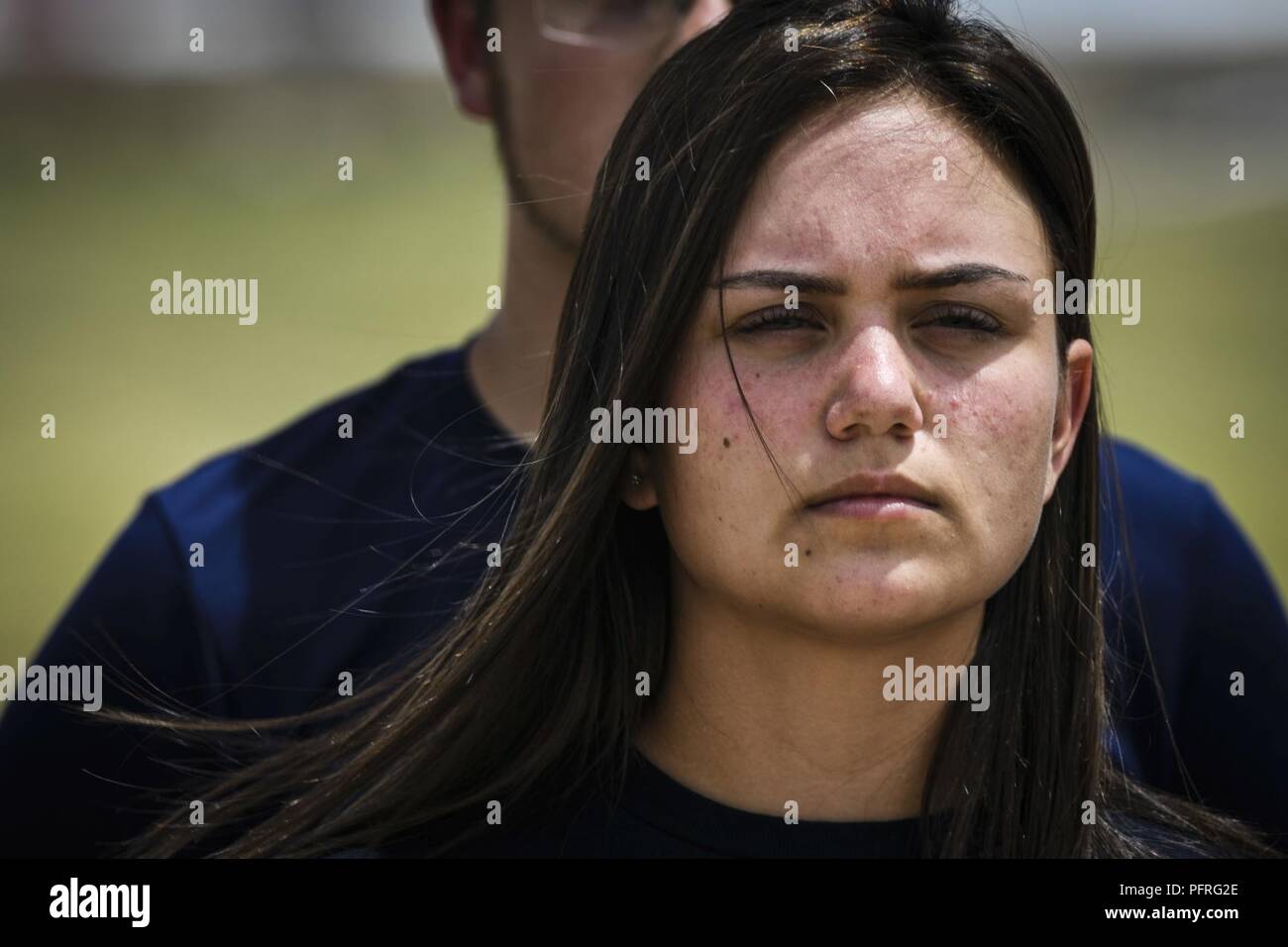 Delayed Entry Program personnel stand on the flightline awaiting ...