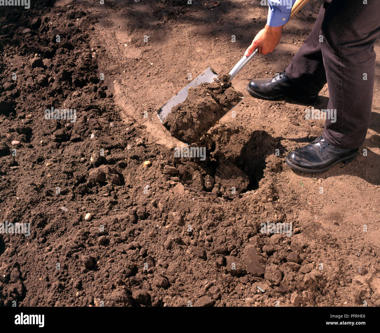 Man digging with spade hi-res stock photography and images - Alamy