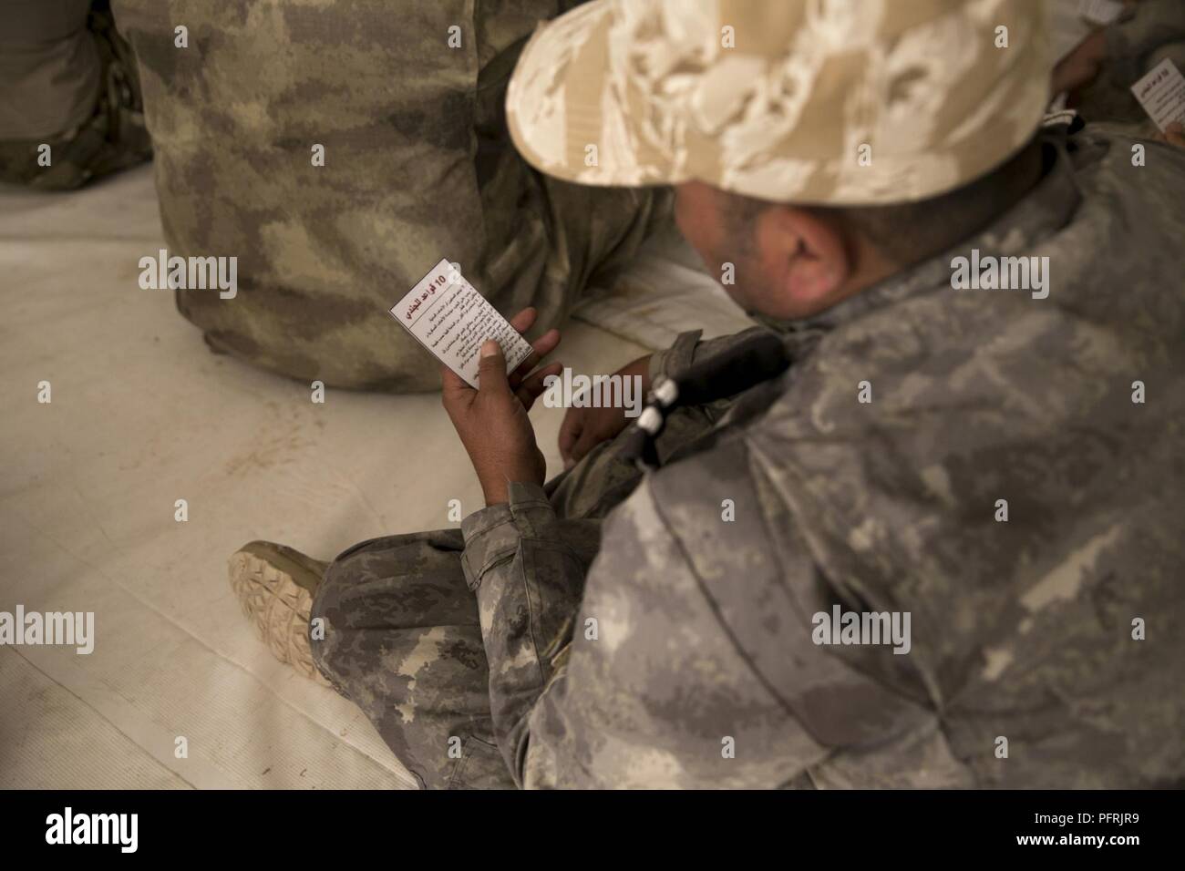 An Iraqi Border Guard Force member reviews Ten Soldier’s Rules after ...