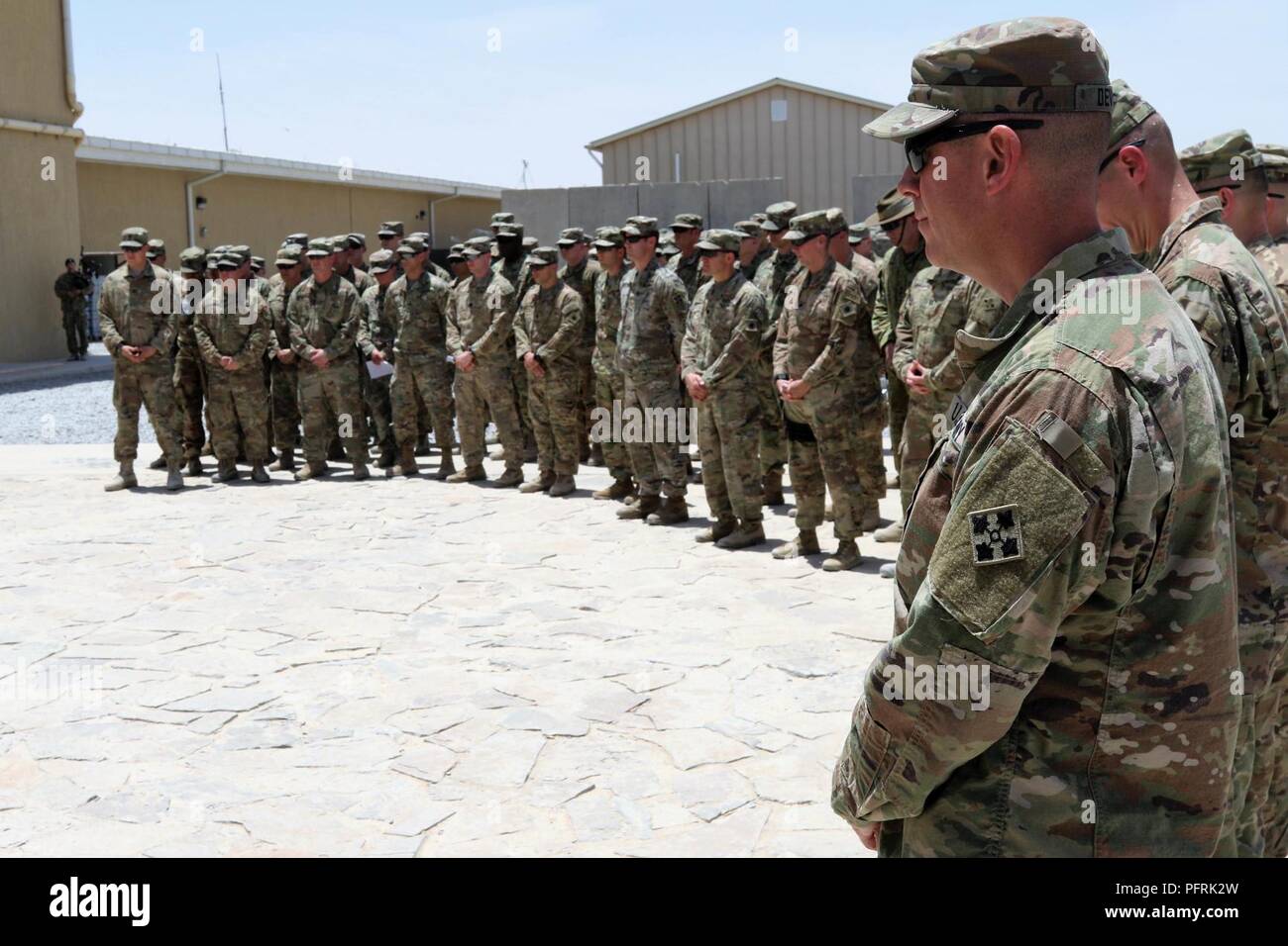 Soldiers and leaders pay their respects with a moment of silence during ...