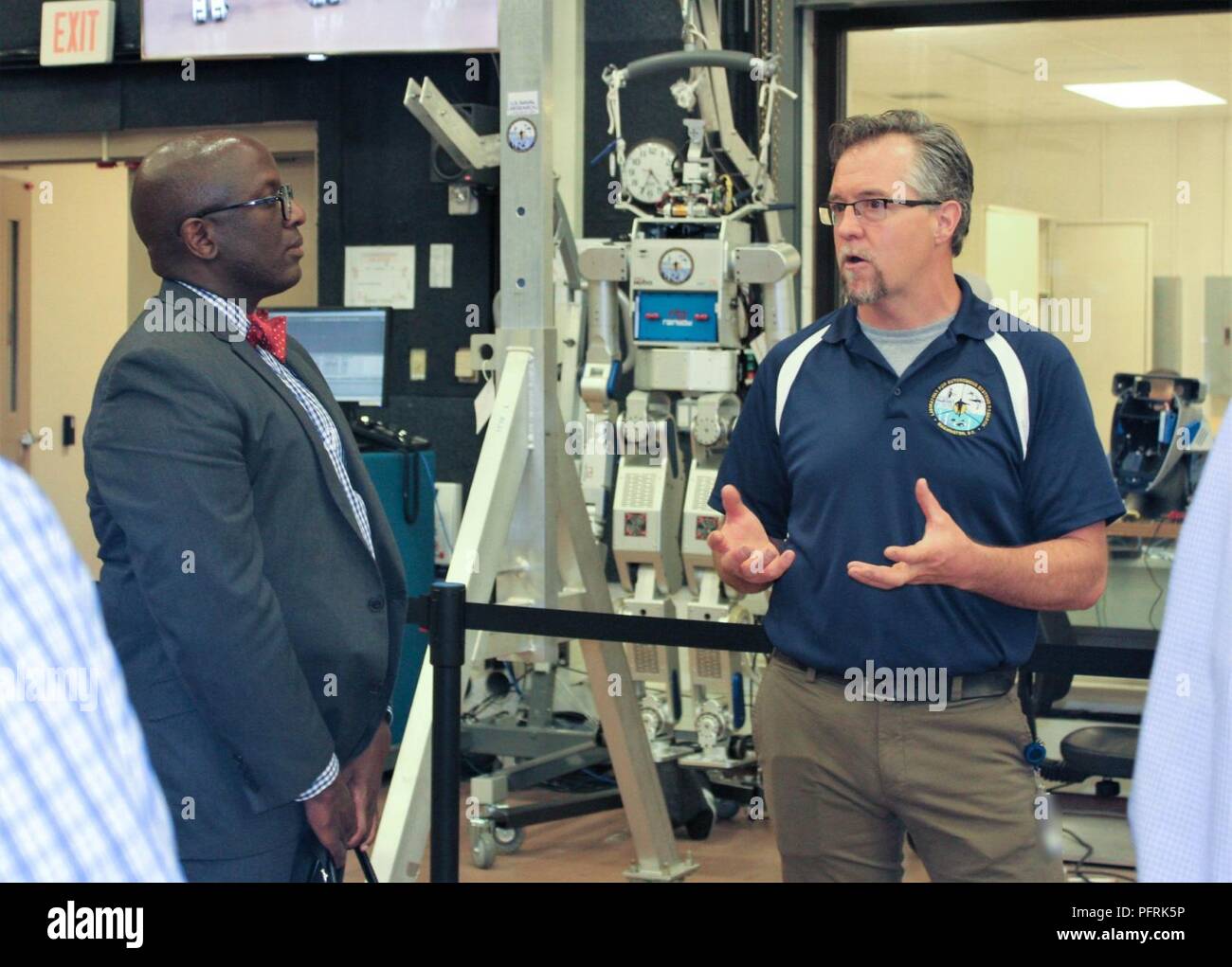 Dr. Jaret C. Riddick (left) listens as Allen O’Hara, facilities manager ...