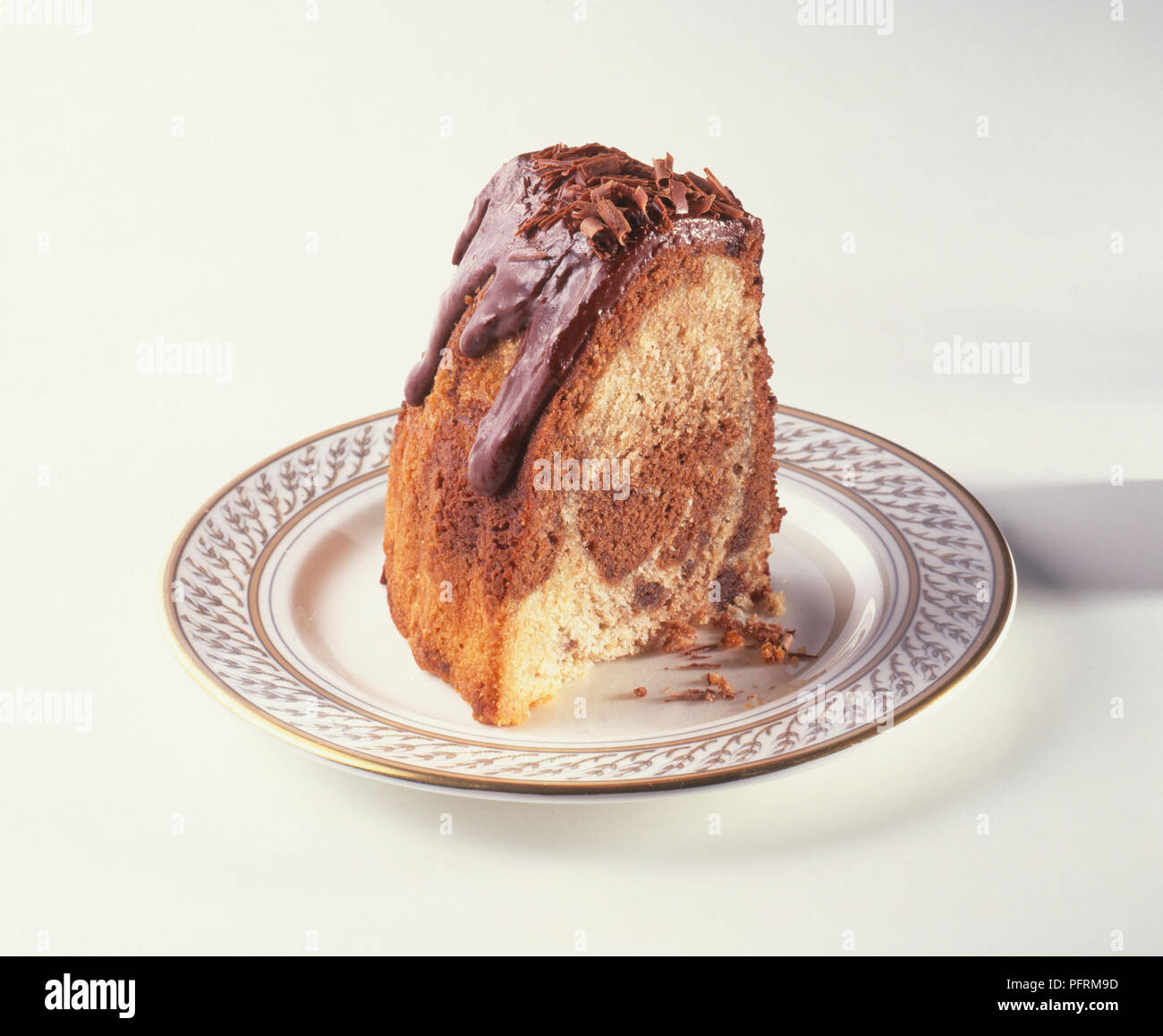 Slice of marble cake with chocolate icing Stock Photo - Alamy