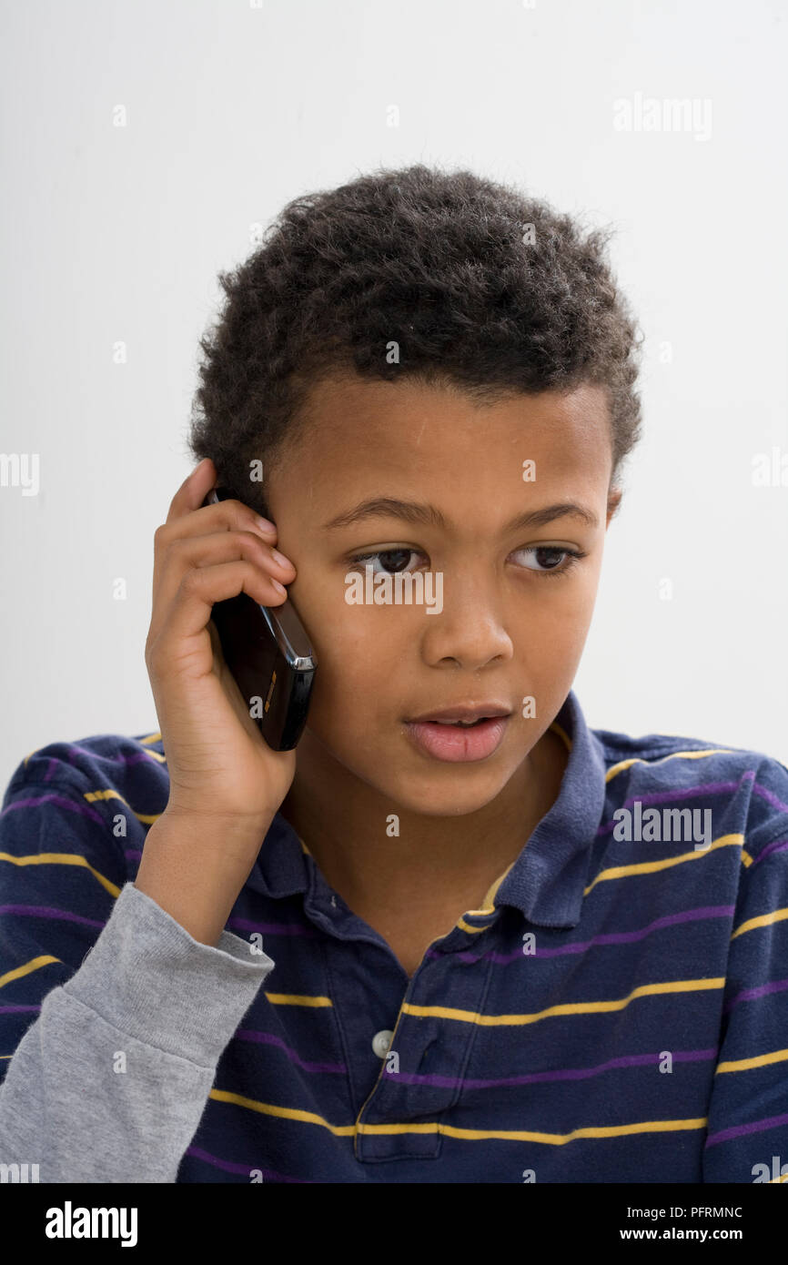Boy using a mobile phone Stock Photo - Alamy