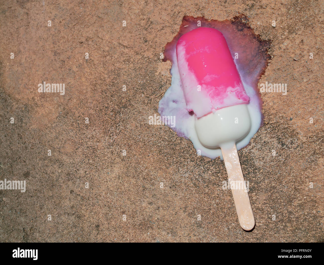Pink Popsicle Ice Pop Fall on The Cement Floor and Melting from Hot ...