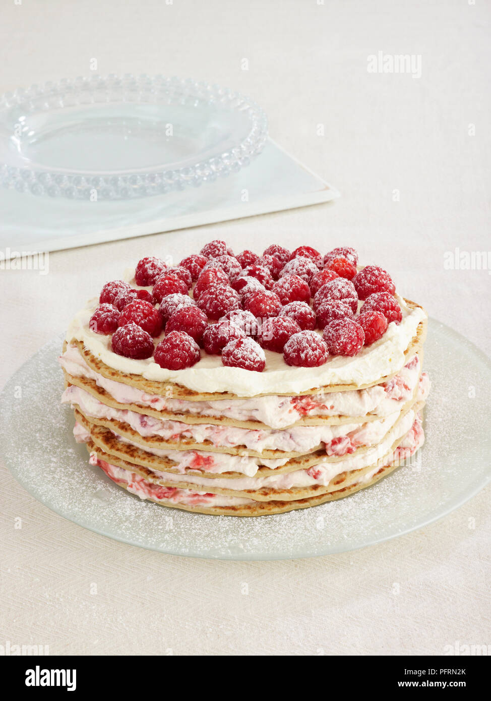 Swedish pancake stack cake topped with raspberries Stock Photo - Alamy