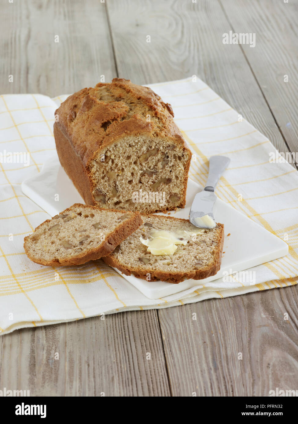 Banana and walnut bread, loaf and buttered slices Stock Photo - Alamy