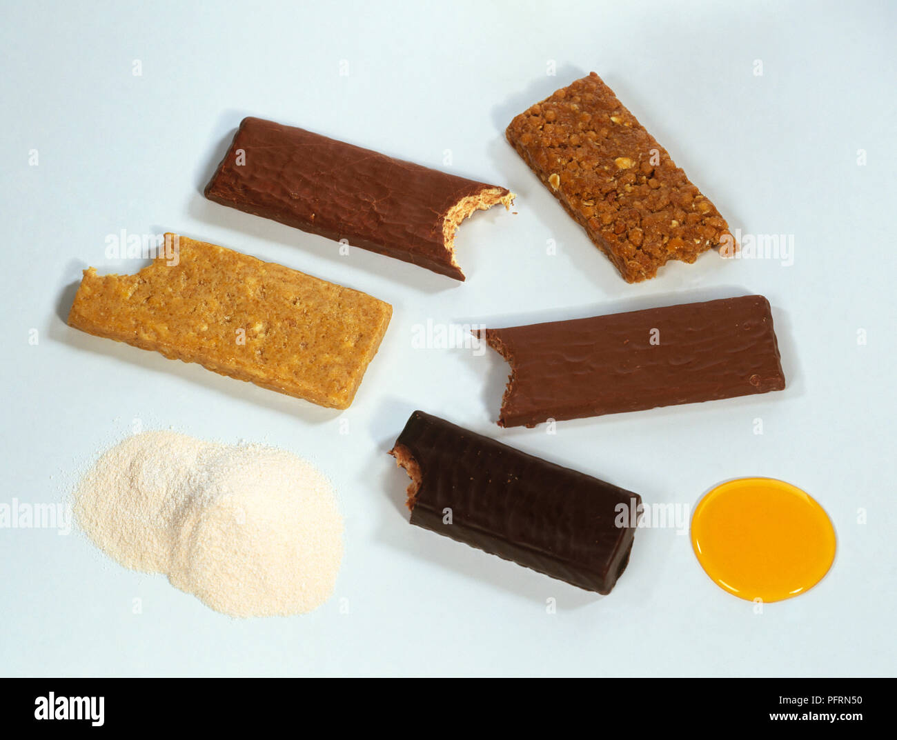 Energy bars, honey and protein powder Stock Photo - Alamy