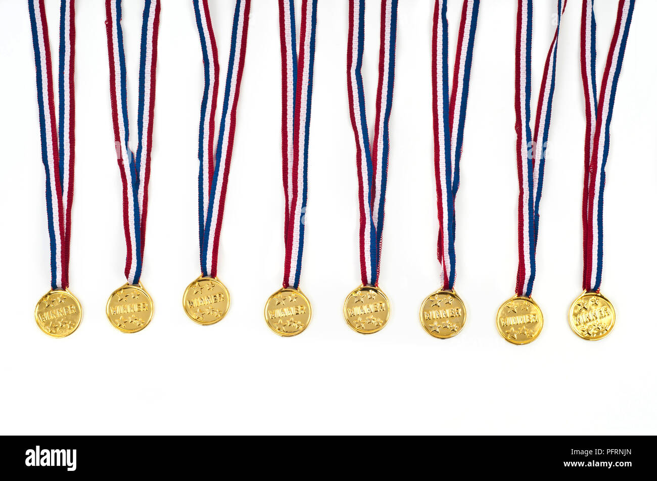Gold medals arranged in a row Stock Photo - Alamy
