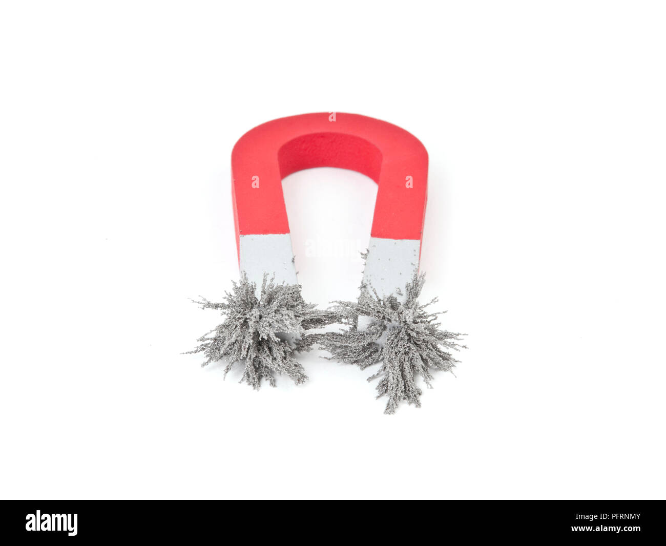 Magnetic attraction iron filings Cut Out Stock Images & Pictures - Alamy