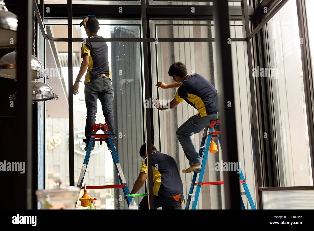 Unidentified worker applying tinted layer on glass window Stock Photo ...