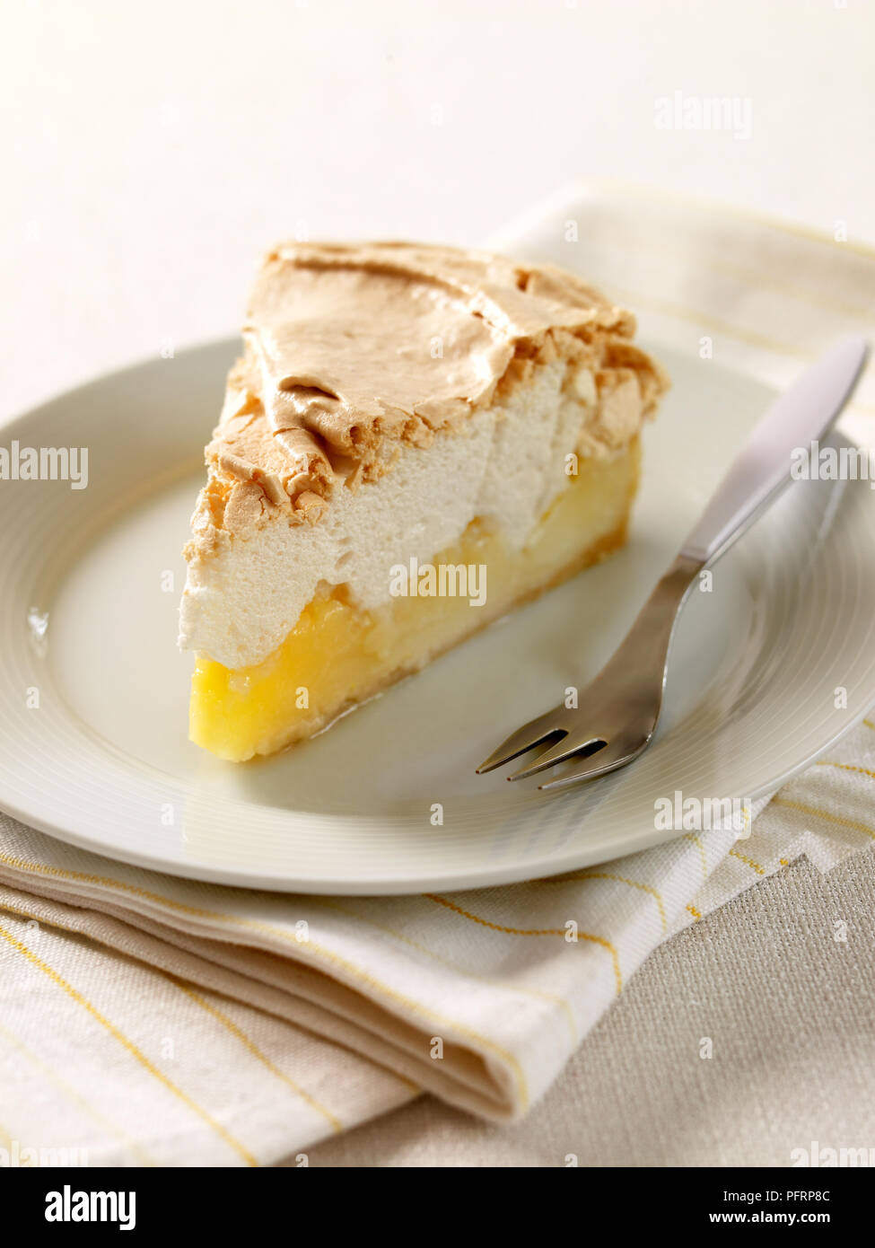 Lemon meringue pie slice Stock Photo - Alamy