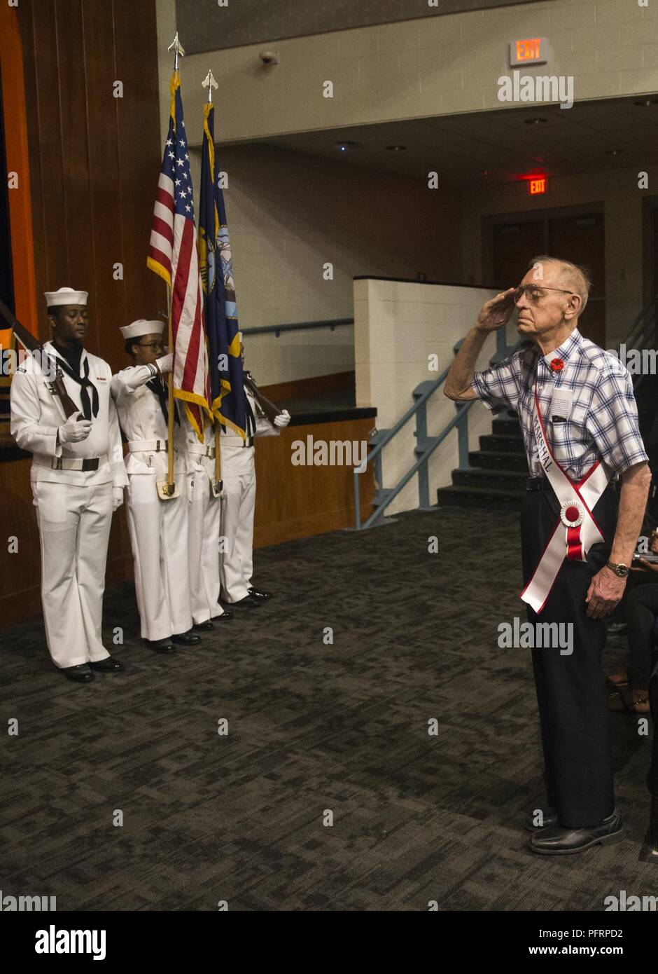 A veteran salutes during the playing of the National Anthem at the ...
