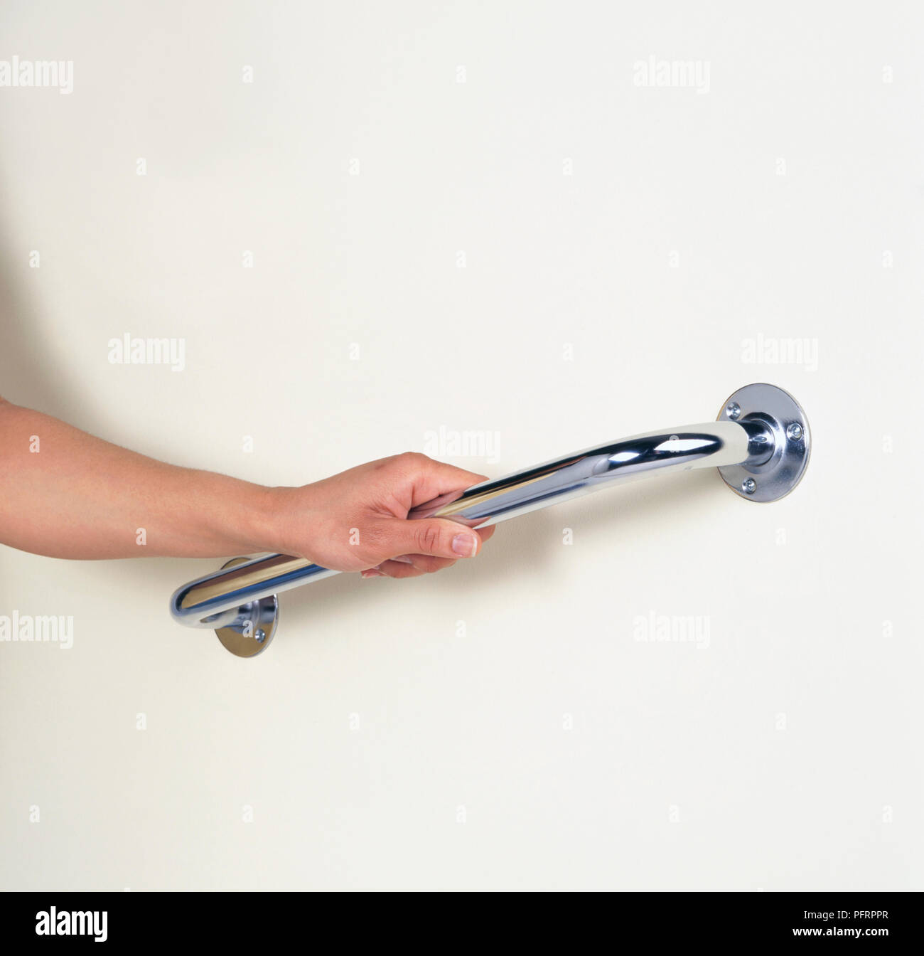 Woman's hand holding stainless steel rail for support Stock Photo - Alamy