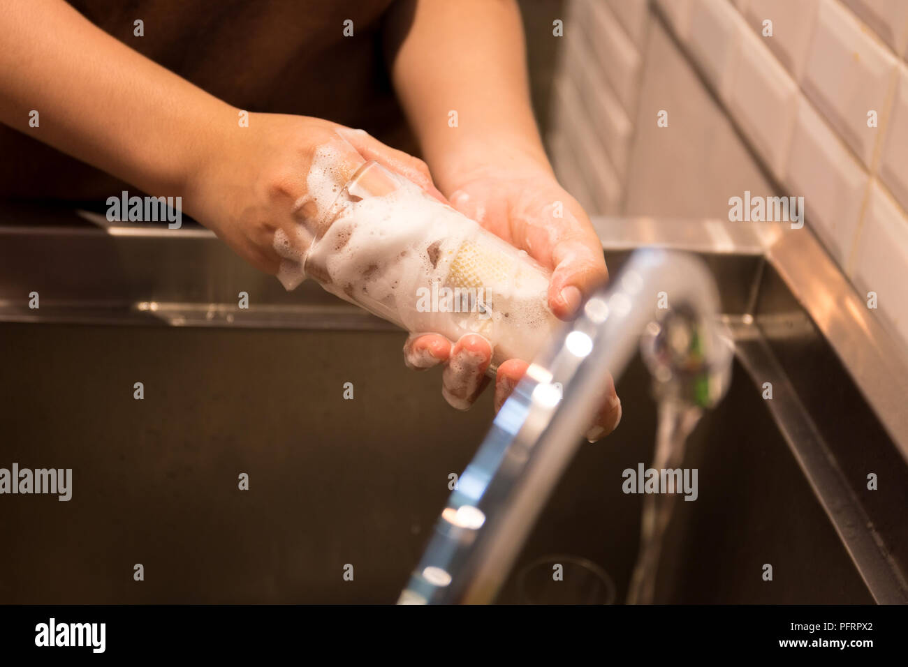 Woman cleaning restaurant kitchen hi-res stock photography and images ...