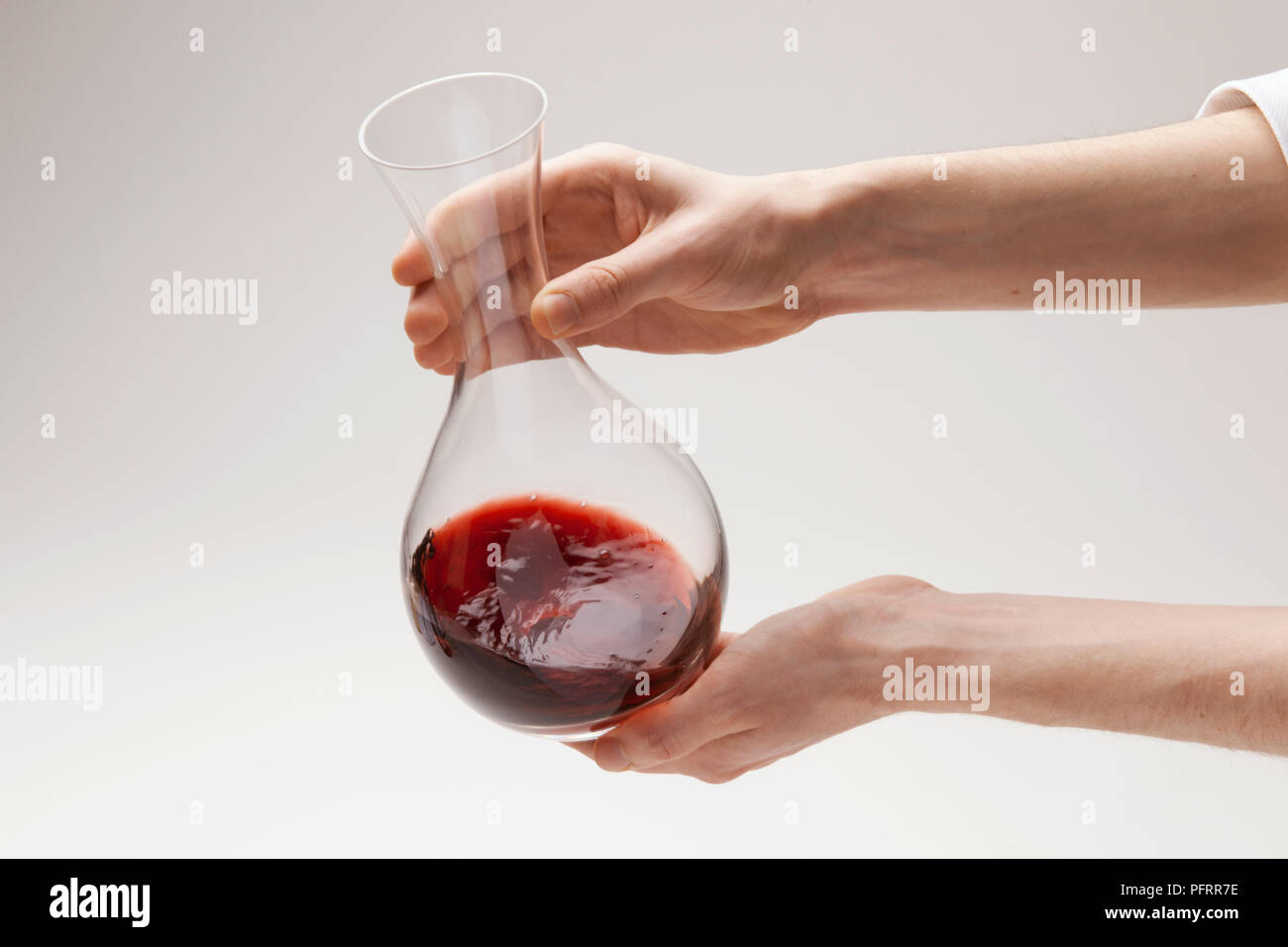 Shaking red wine in decanter, close-up Stock Photo - Alamy