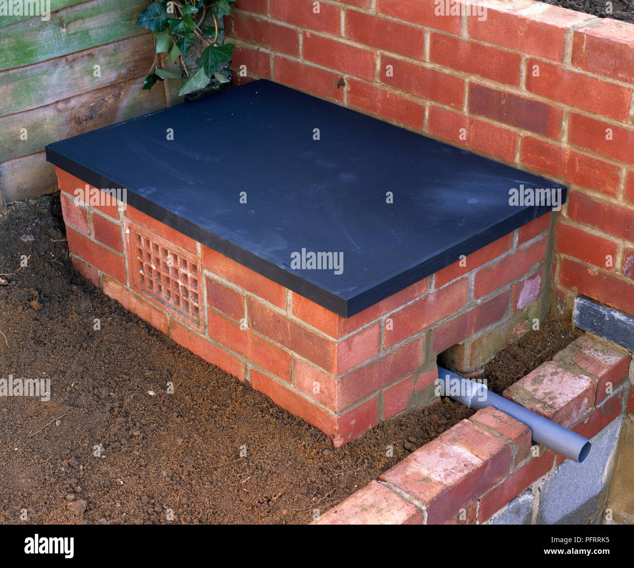 Simple pump chamber for water garden constructed of brick with air ...