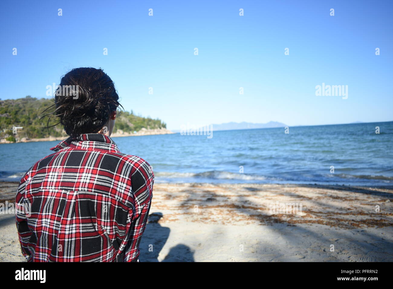 girl looking the sea in Nelly Bay, Australia Stock Photo - Alamy