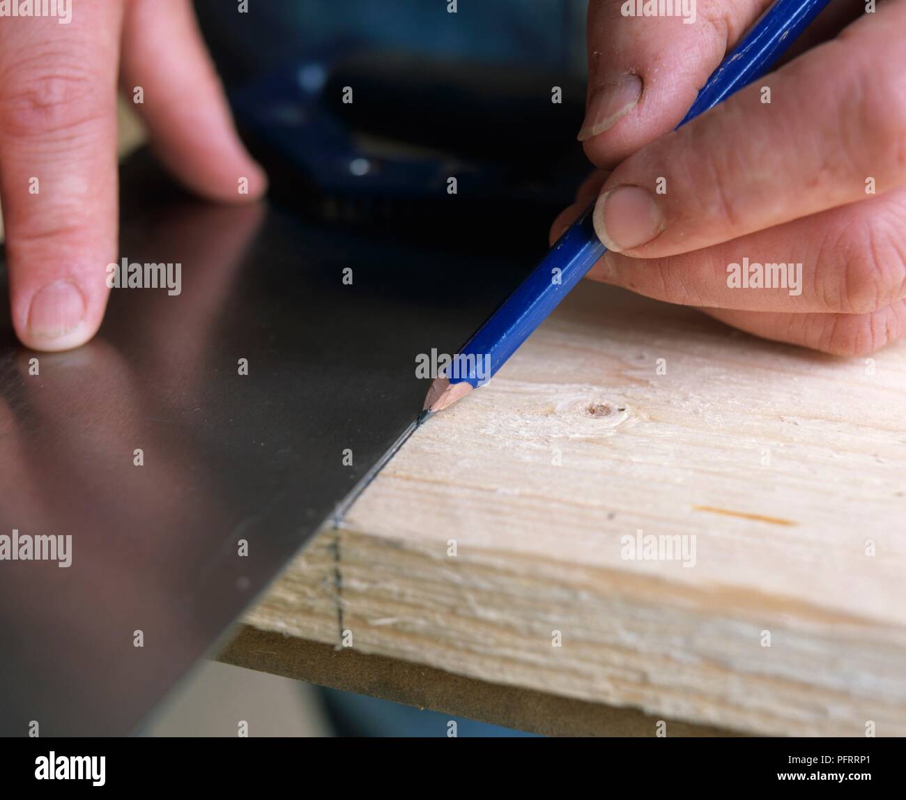 Marking up timber with pencil, close-up Stock Photo - Alamy