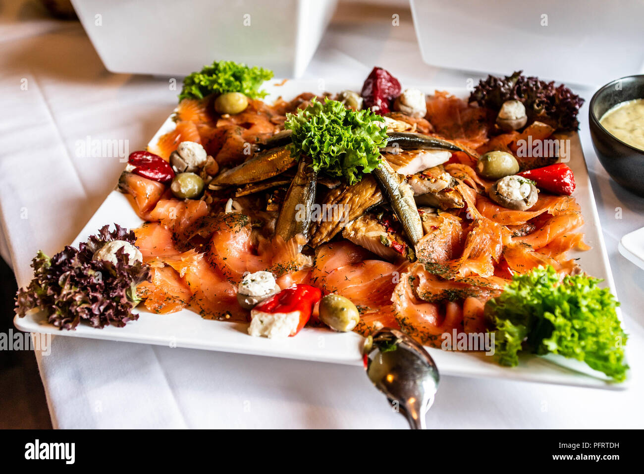 delicious big fish plate with complete fishbody and salmon steak with ...