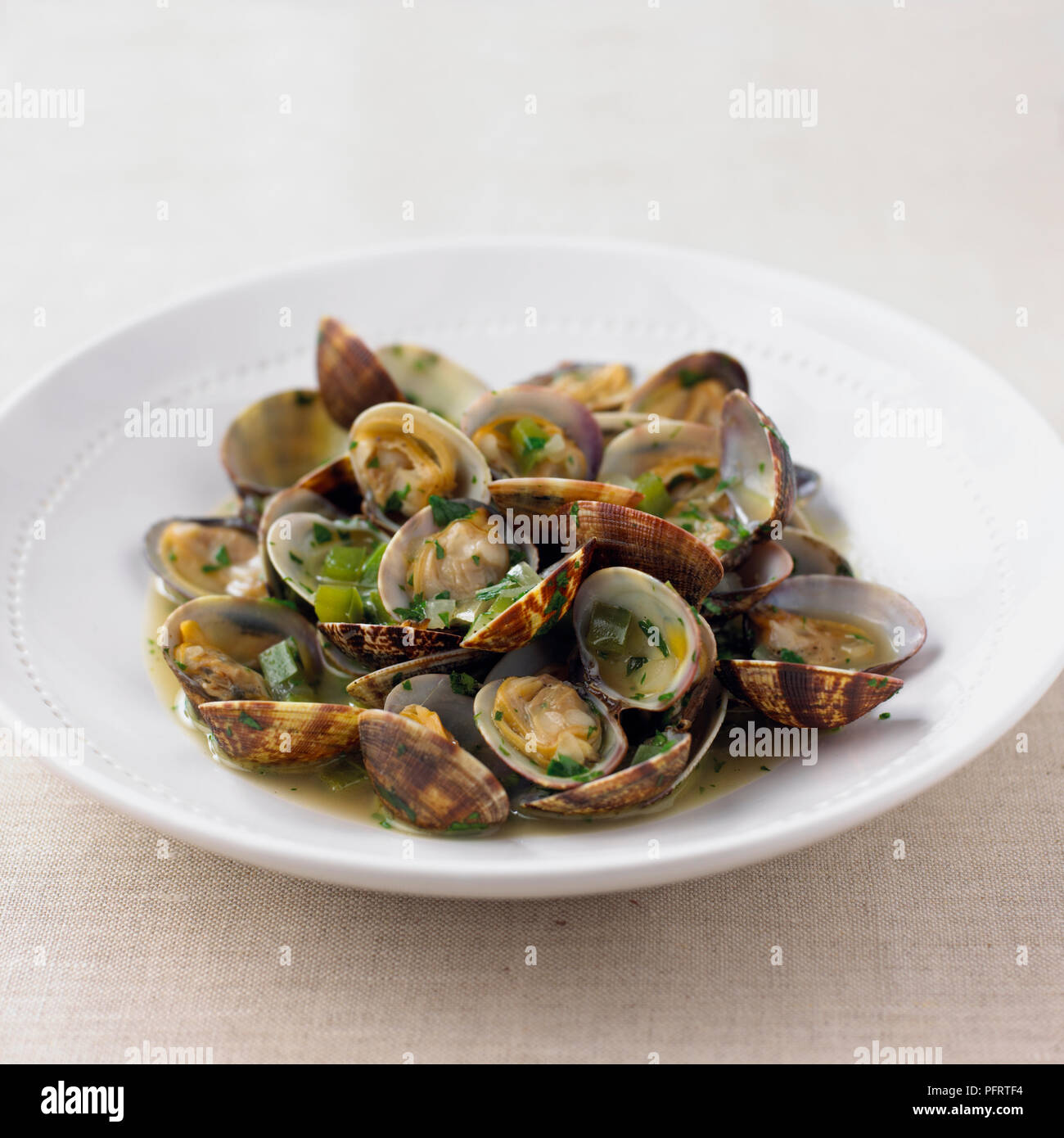 Pan-fried clams with parsley and garlic Stock Photo - Alamy