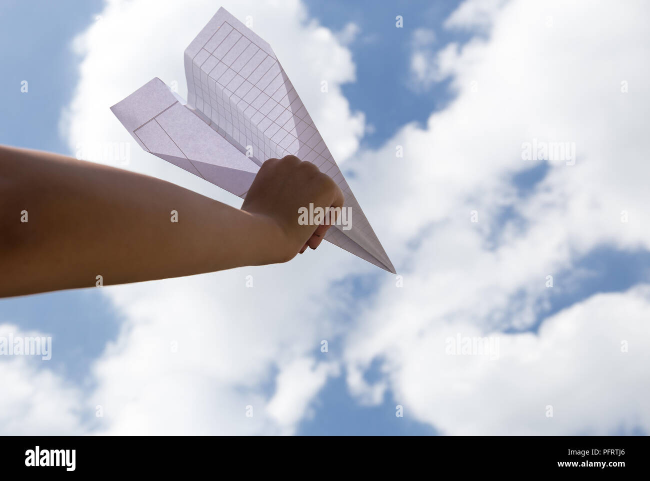 Little boy playing paper plane isolated Stock Photo - Alamy
