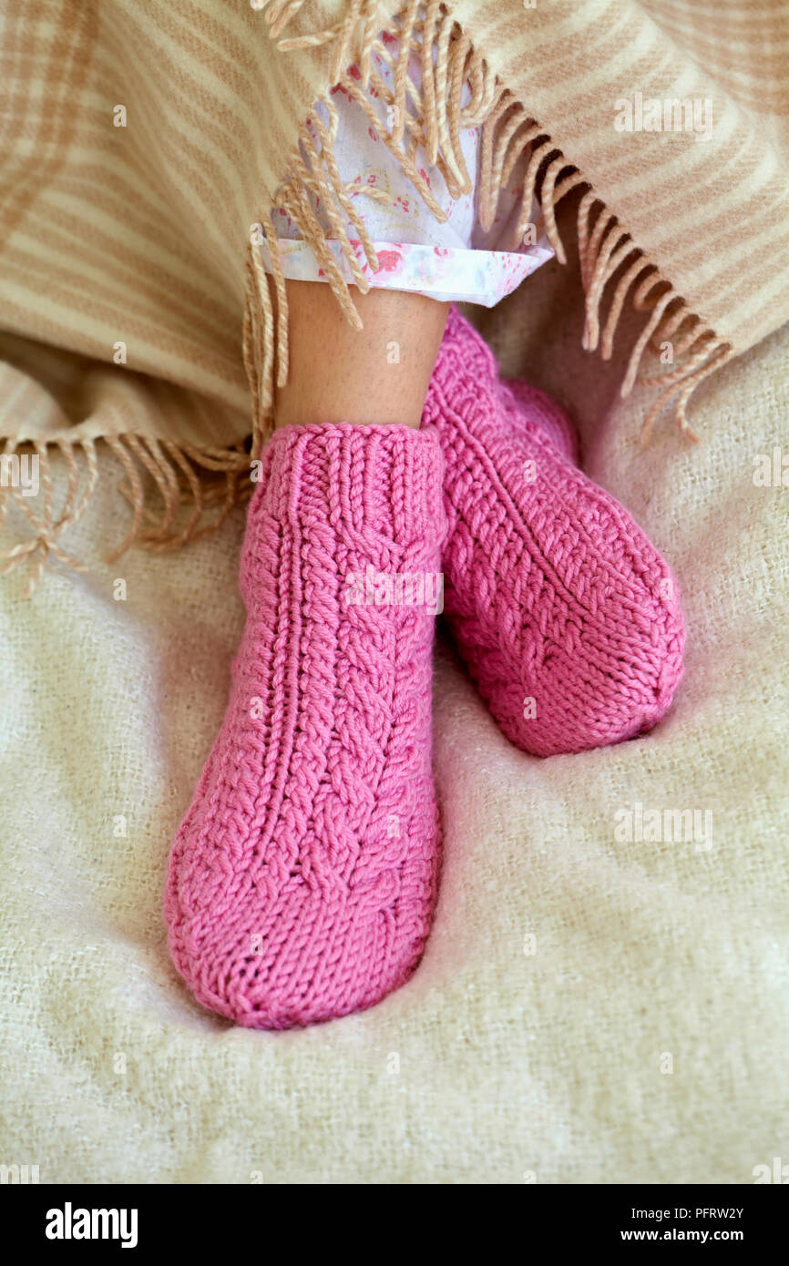 Woman wearing knitted cabled socks Stock Photo - Alamy
