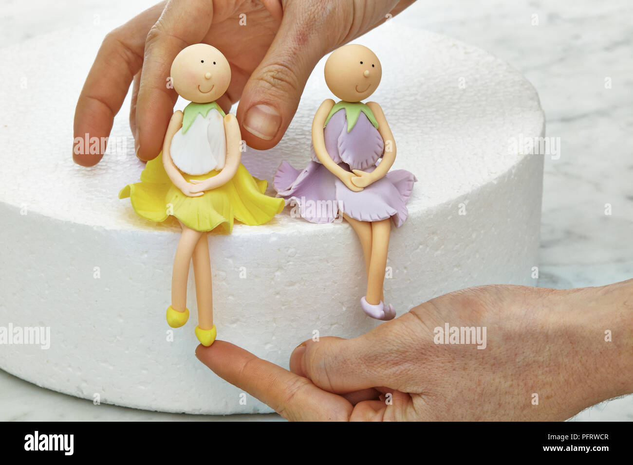 Human hand placing figure hi-res stock photography and images - Alamy