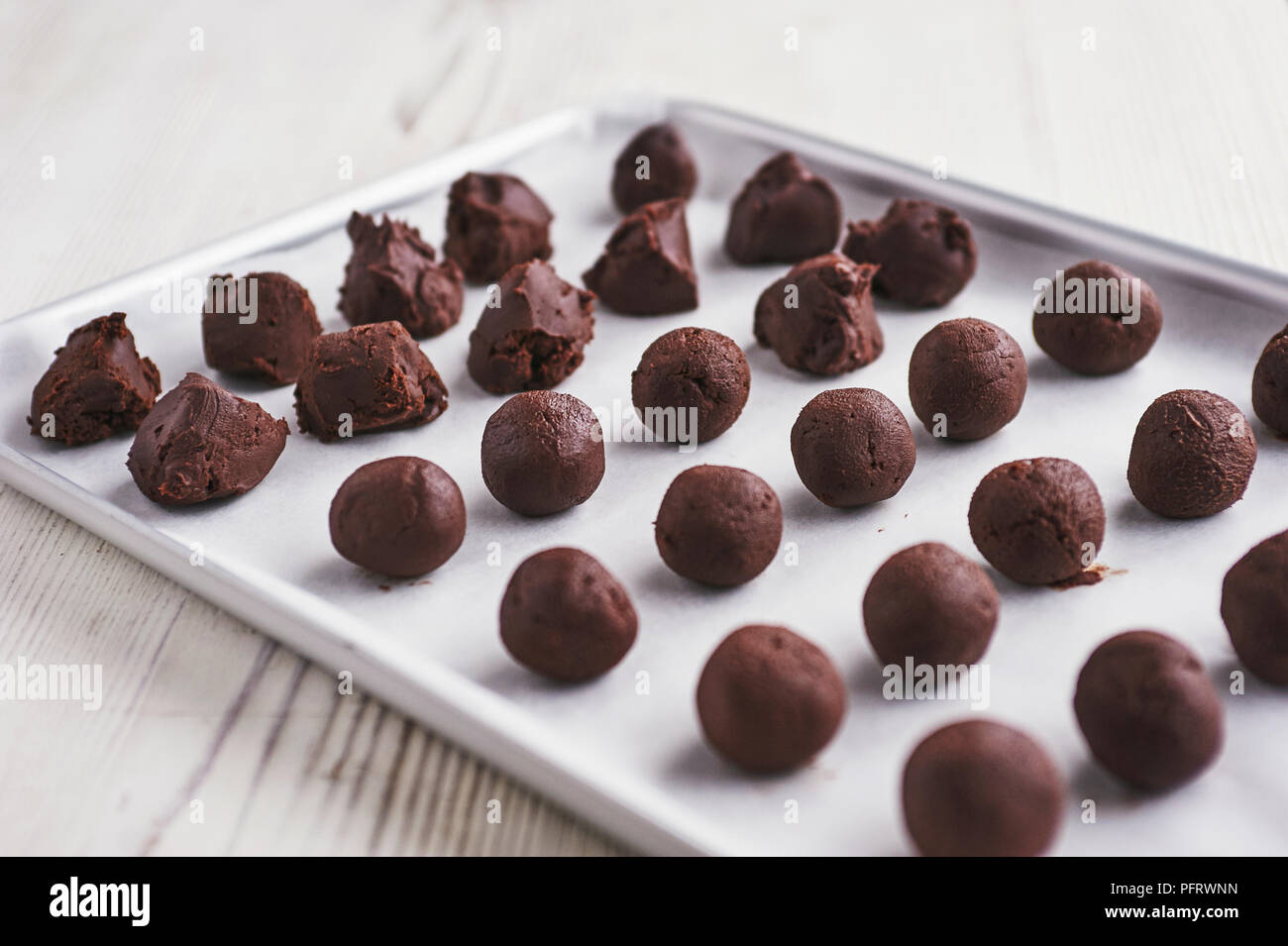 Rolling and dipping truffles Stock Photo - Alamy