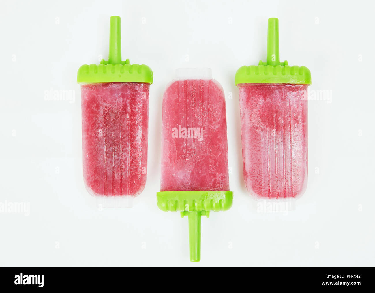 Frozen ice lollies with green handles Stock Photo - Alamy