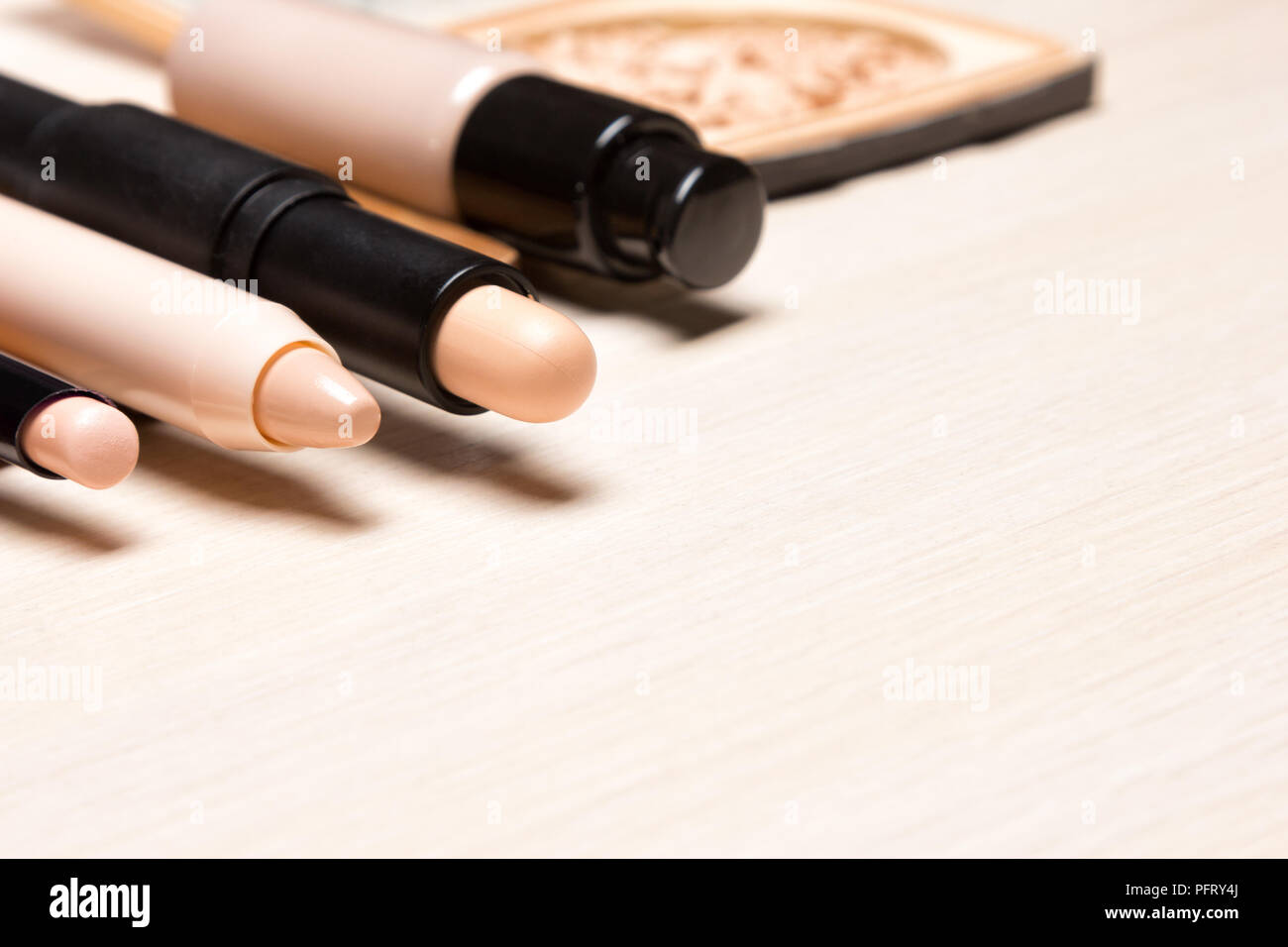 Make-up products to hide skin imperfections. Different concealers. Side ...